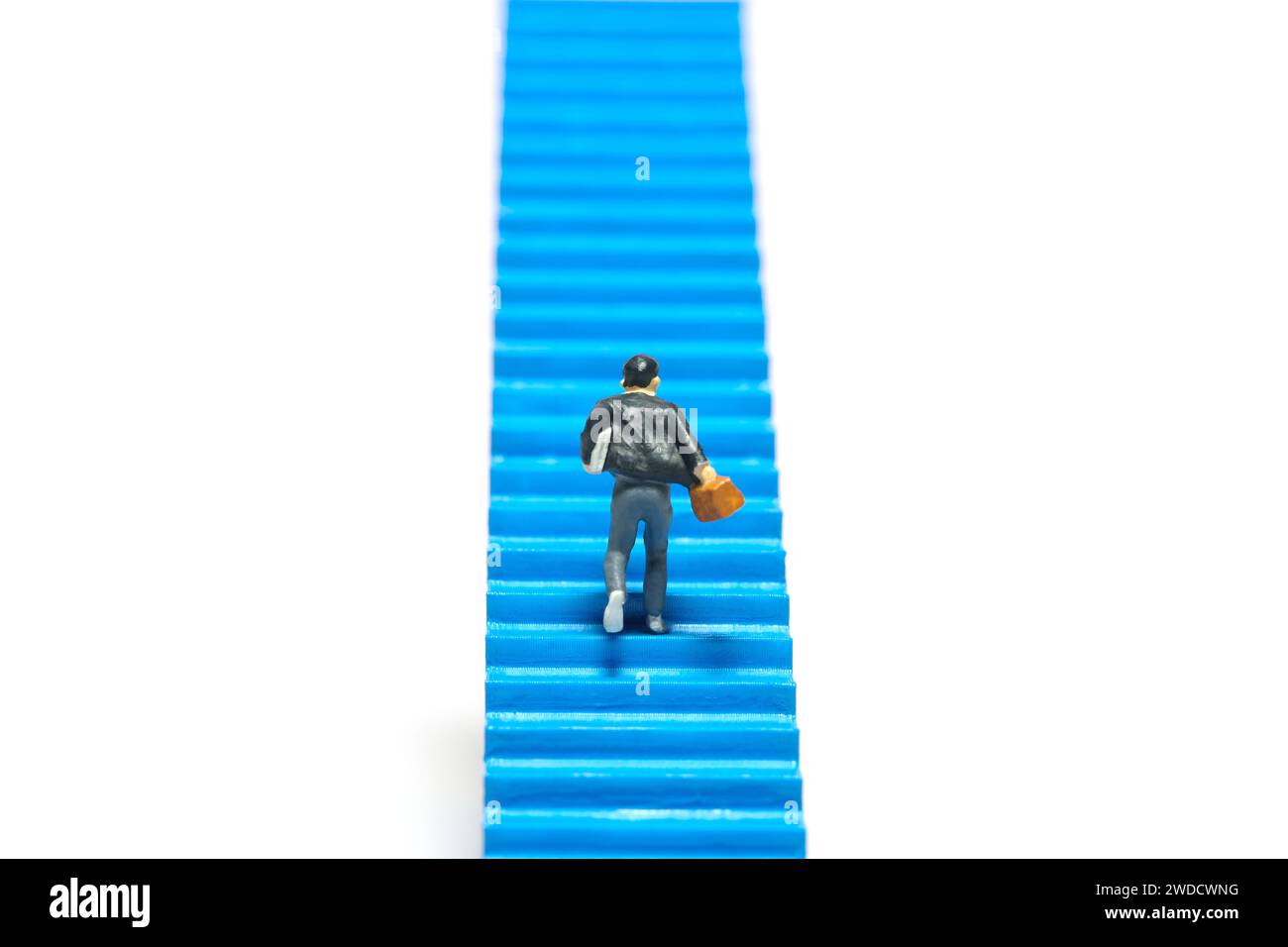 Miniature people toy figure photography. A boy pupil student running on ...