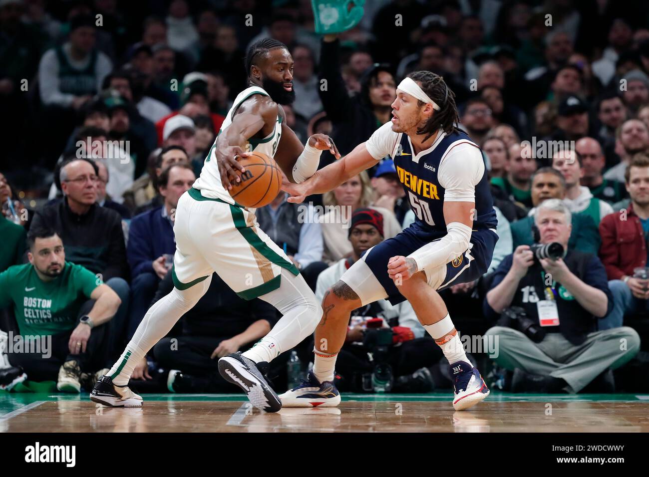 Boston Celtics' Jaylen Brown (7) drives past Denver Nuggets' Aaron ...
