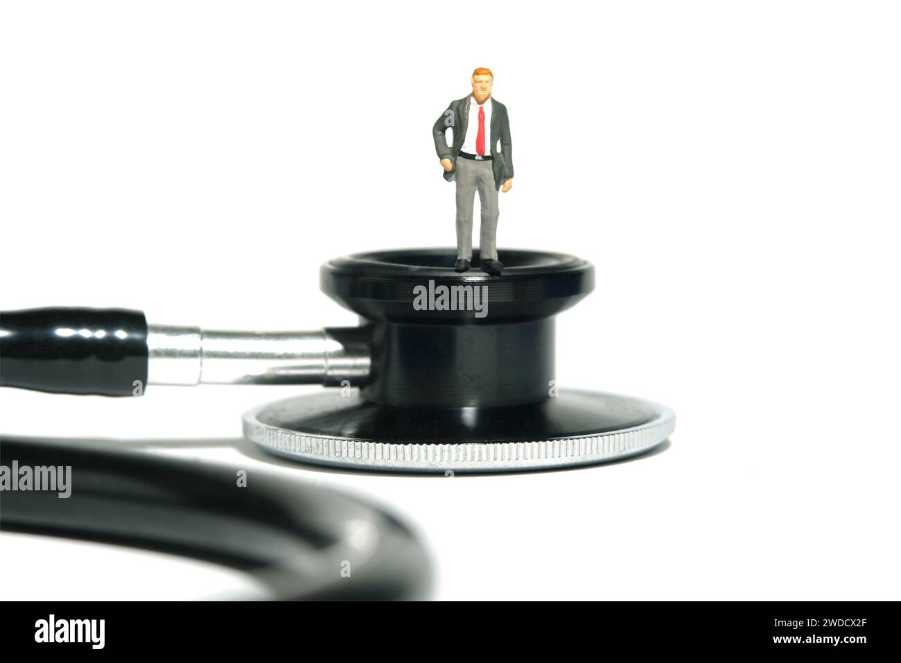 Miniature tiny people toy figure photography. A men standing above ...