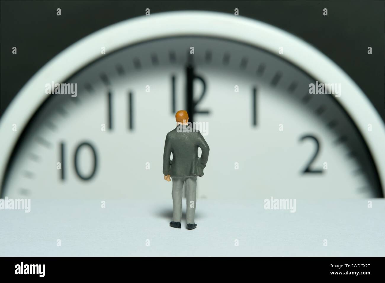 Miniature tiny people toy figure photography. A businessman standing in ...