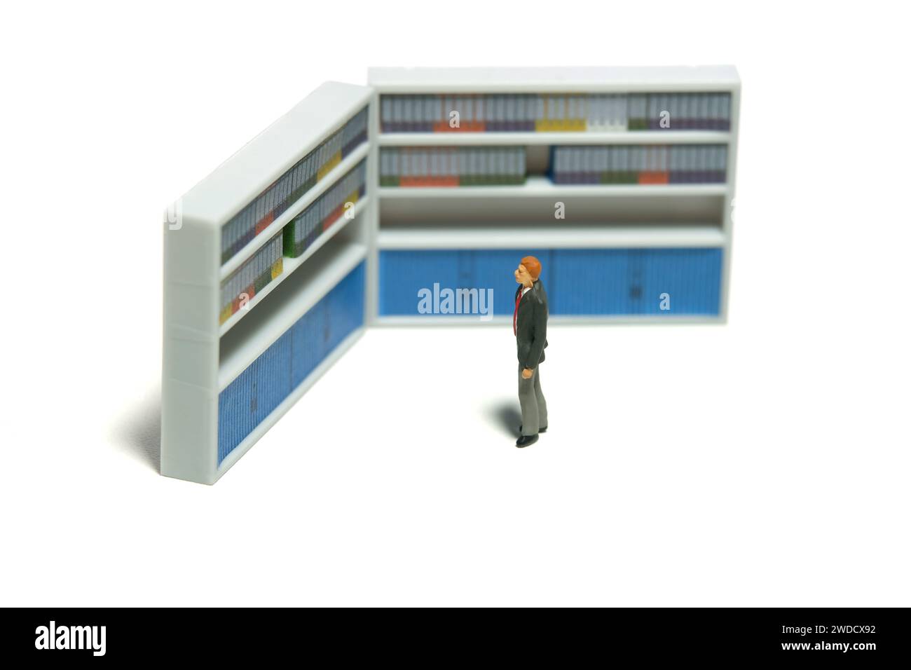 Miniature tiny people toy figure photography. Office file management. A ... Miniature tiny people toy figure photography. Office file management. A ...
