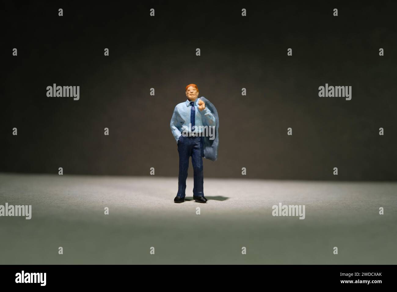 Miniature tiny people toy figure photography. A businessman standing ...