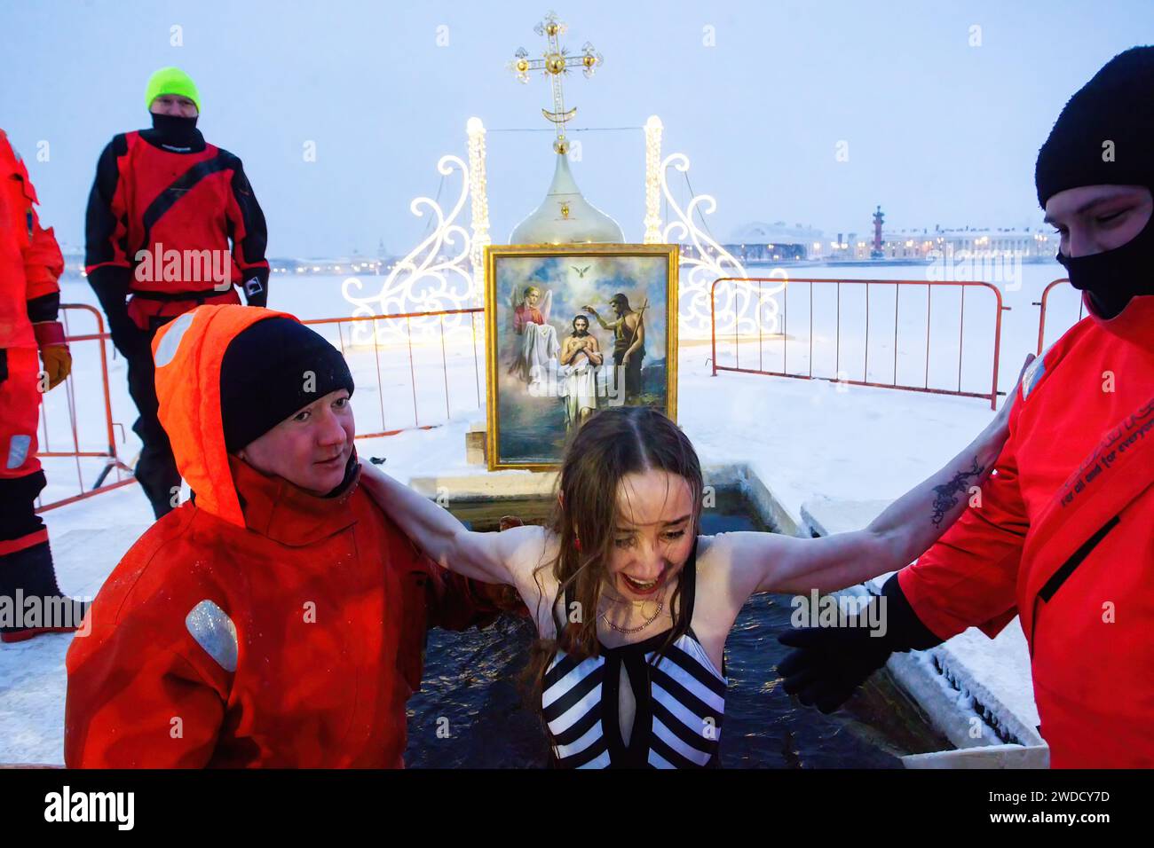 St. Petersburg, Russia. 19th Jan, 2024. A young woman is helped out of ...