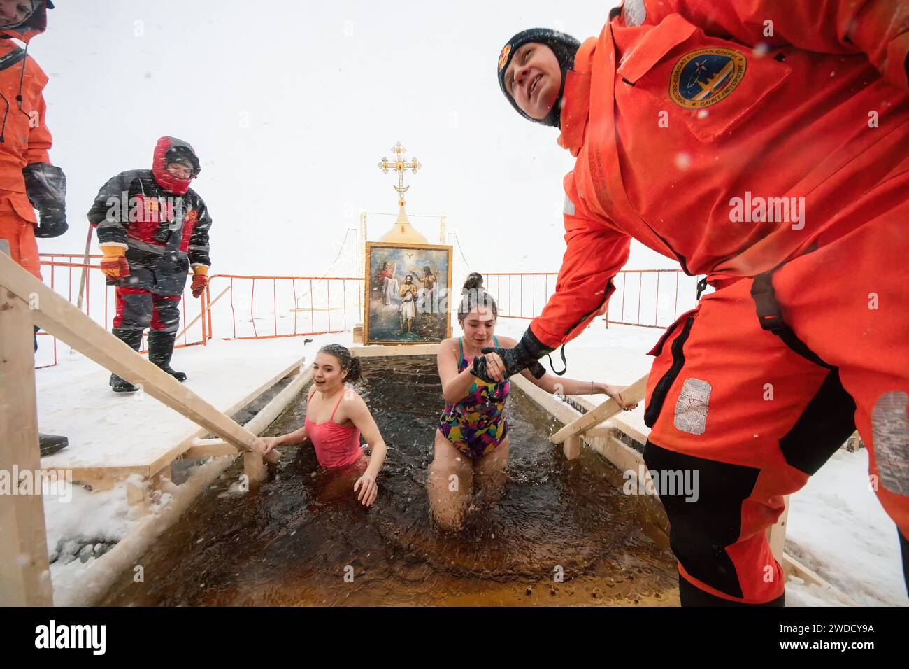 St. Petersburg, Russia. 19th Jan, 2024. Young women are seen during Epiphany bathing in the font ...