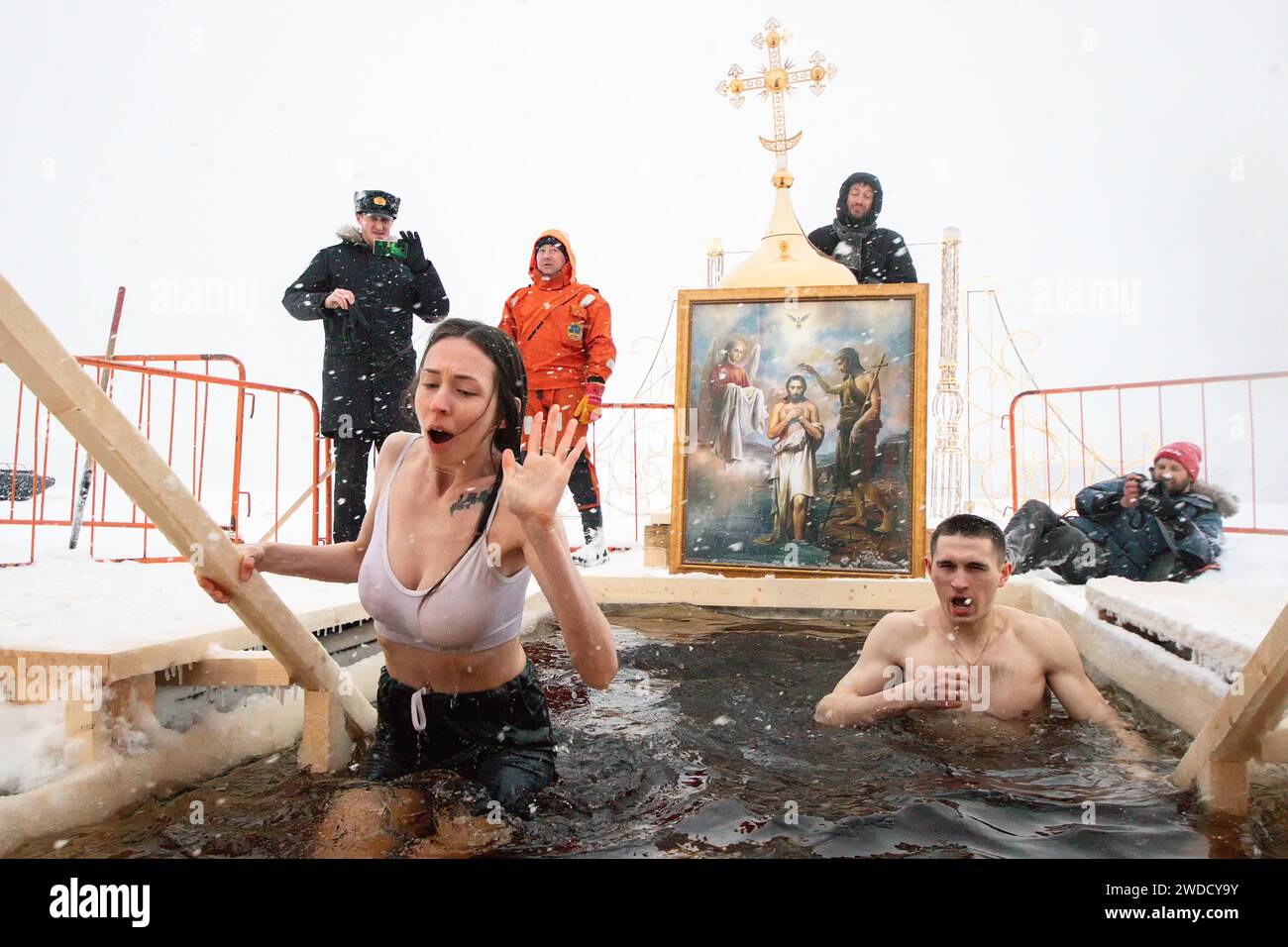 St. Petersburg, Russia. 19th Jan, 2024. People are seen during Epiphany bathing in a font on the ...