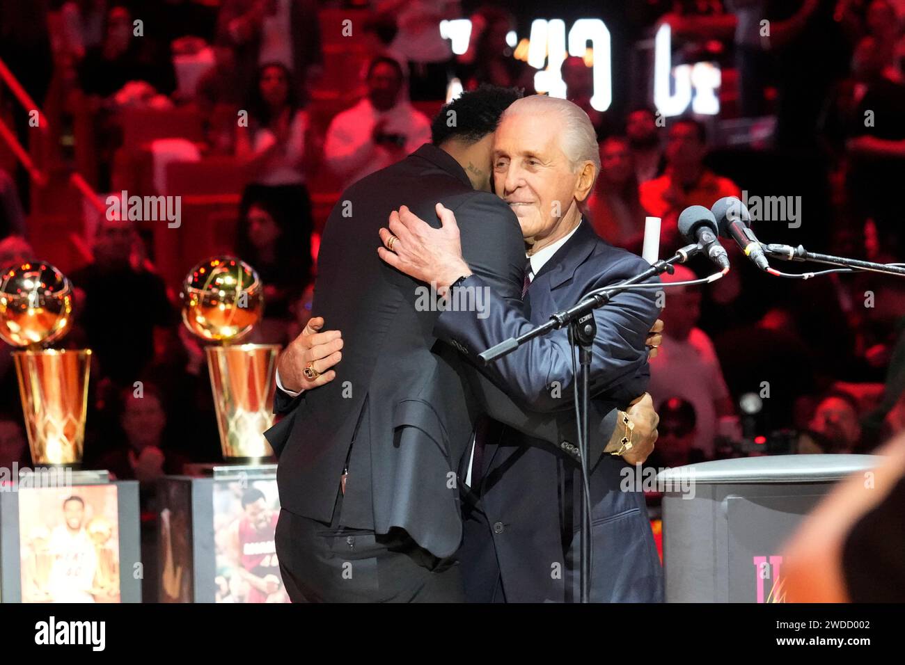 Miami Heat president Pat Riley hugs former player Udonis Haslem during ...
