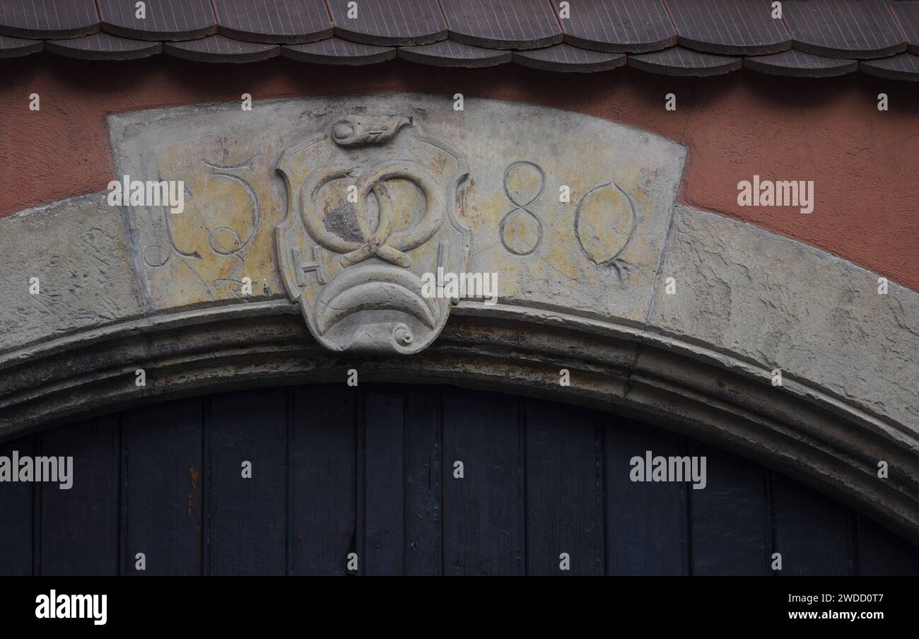 Vintage wooden portal with an antique stone carved crest in Barr ...