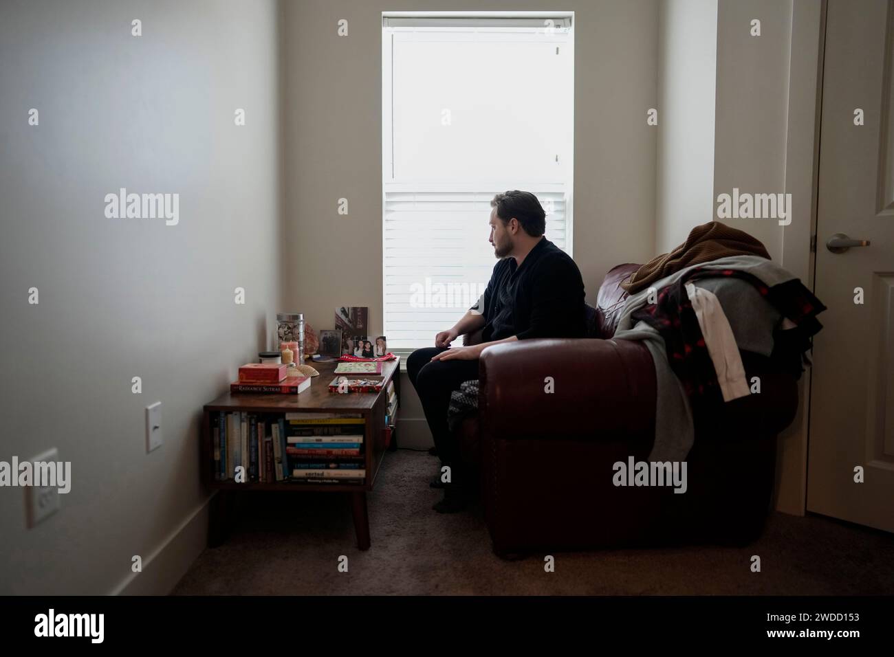 Ashton Colby looks out the window from his meditation corner in his ...