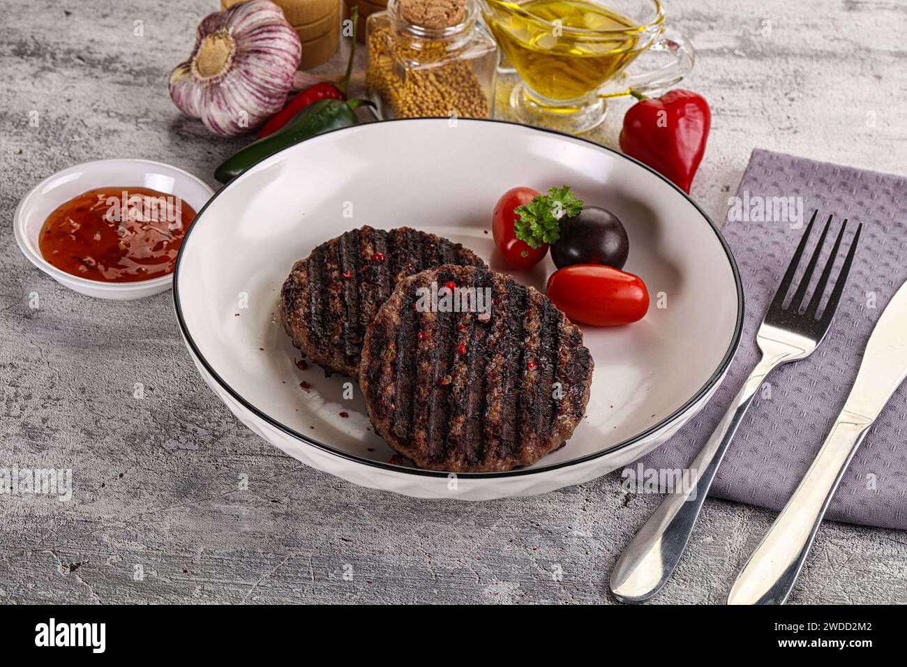 Grilled beef burger cutlet with sauce Stock Photo - Alamy
