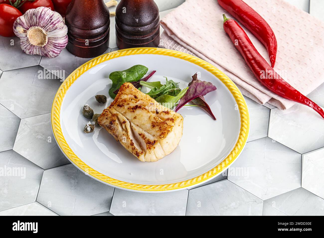 Roasted cod fish steak with salad leaves Stock Photo - Alamy
