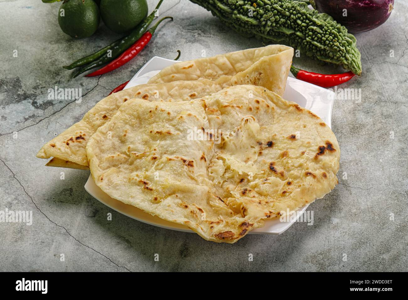 Indian cuisine tandori bread - naan with cheese Stock Photo - Alamy