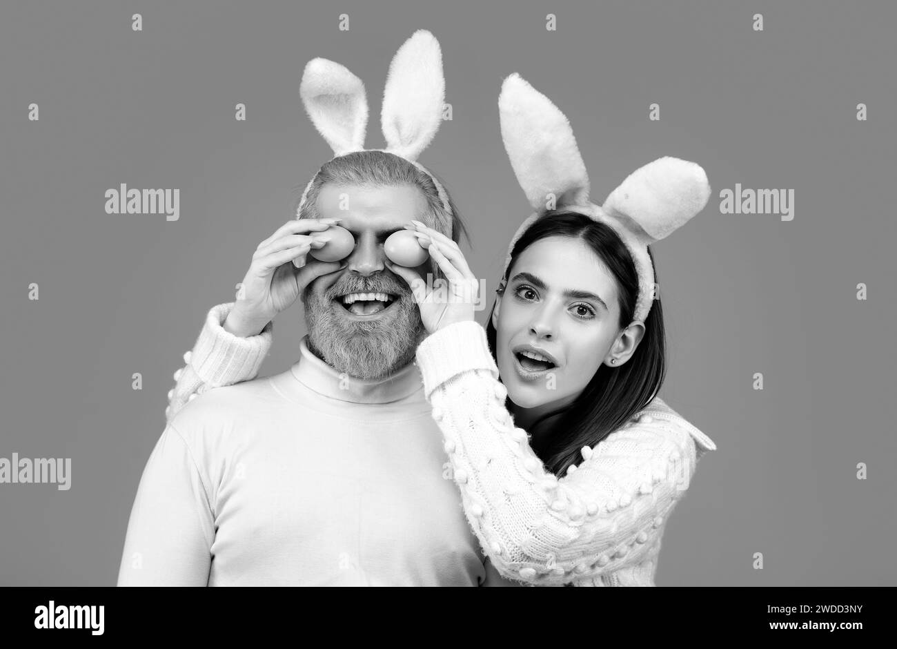 Easter couple. Smiling happy spring couple looking camera Stock Photo ...