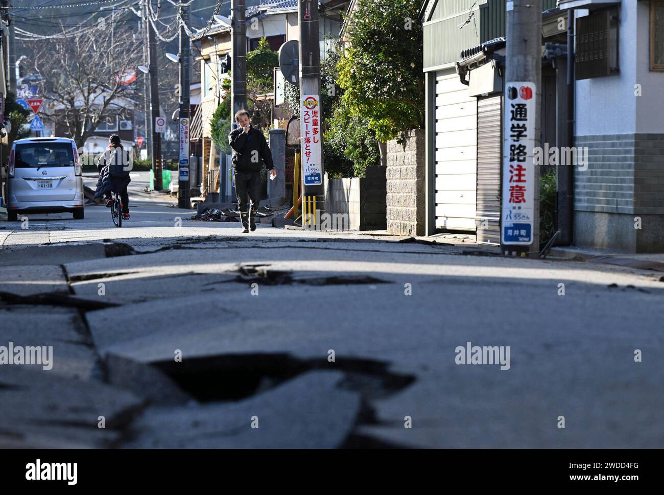 Winding and cracked roads are seen due to soil liquefaction triggered ...