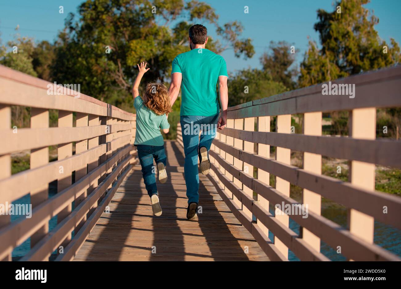 Back view portrait of happy father and son Stock Photo - Alamy
