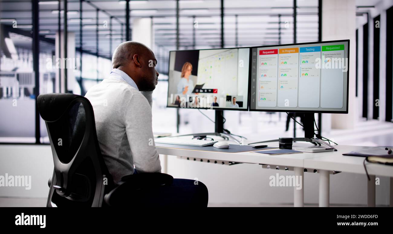 Bored Employee In Video Conference Training Meeting Stock Photo - Alamy