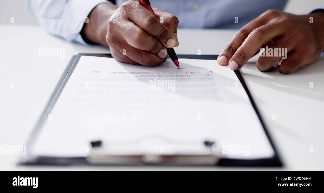 Agreement Form Signature. Hand Signing Paper Using Pen Stock Photo - Alamy