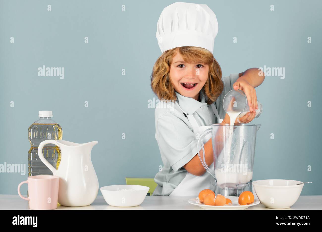 Cooking children. Chef kid boy making fresh vegetables for healthy eat ...