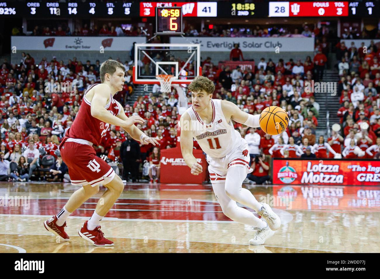 Madison, WI, USA. 19th Jan, 2024. Wisconsin Badgers guard Max Klesmit (11) drives against ...