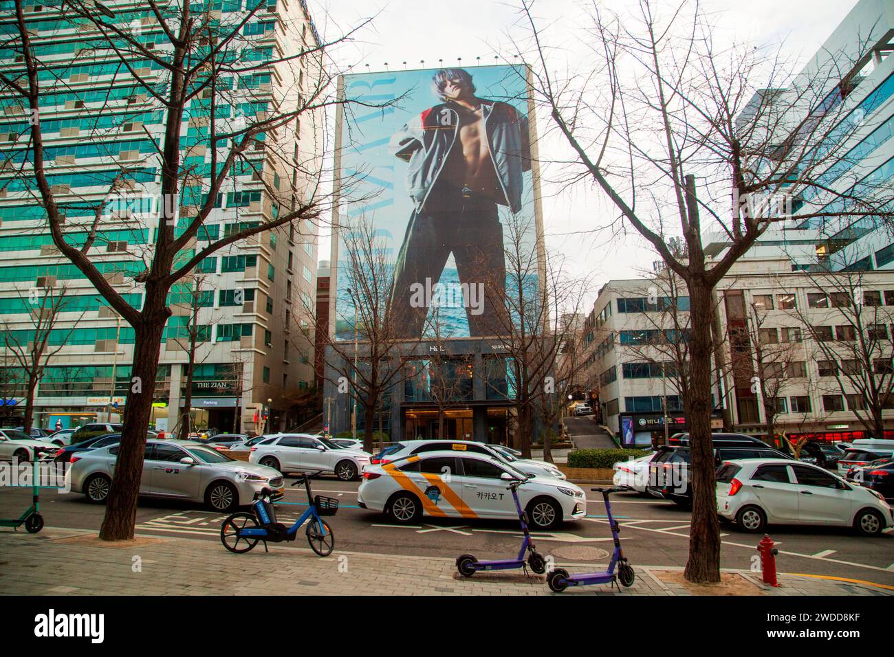 BTS V, Jan 19, 2024 : A large placard covering a building shows BTS V ...