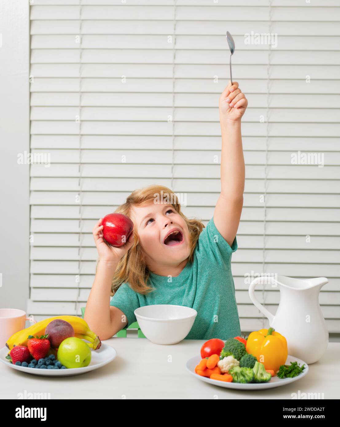 Little excited amazed child boy having healthy breakfast. Children ...