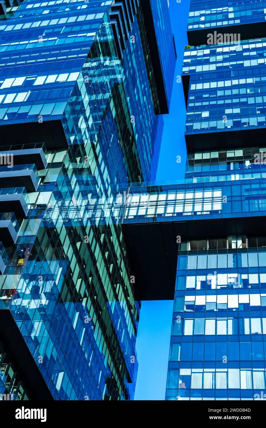 From below of contemporary high rise buildings with glass mirrored ...