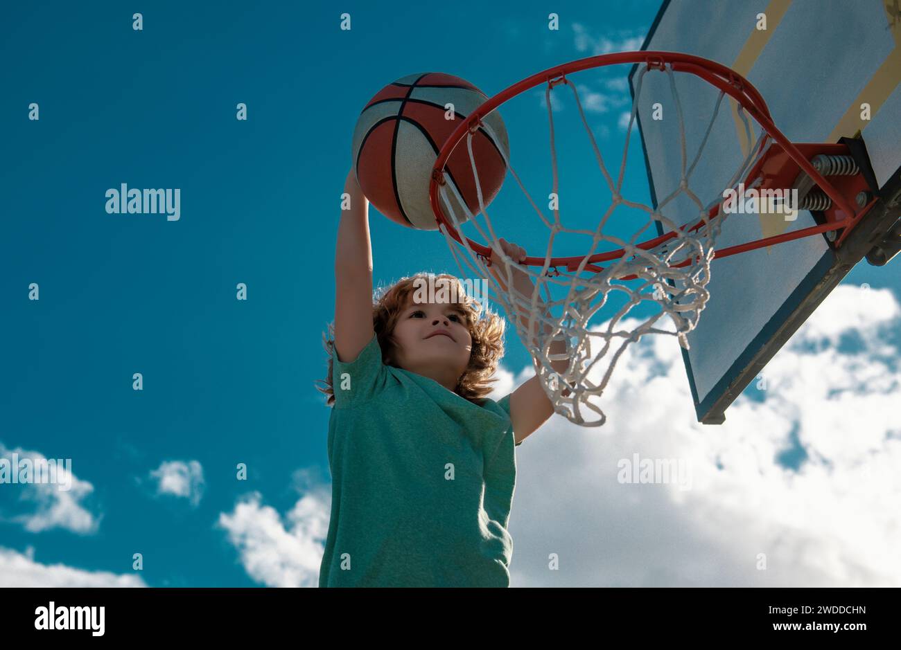 Basketball kids game. Cute little child boy holding a basket ball ...