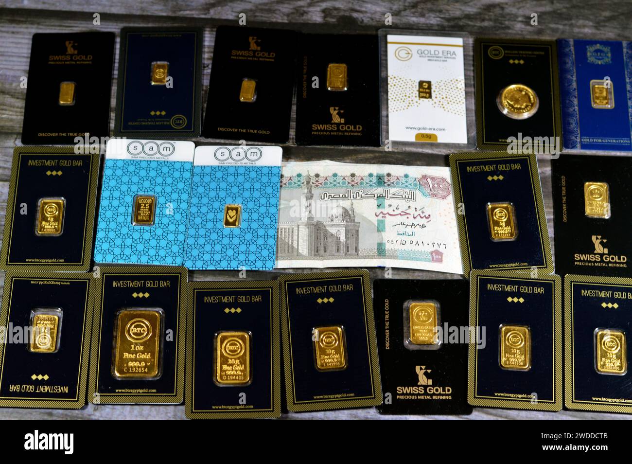 Cairo, Egypt, January 15 2024: Egyptian pounds money and pile of 24K ...