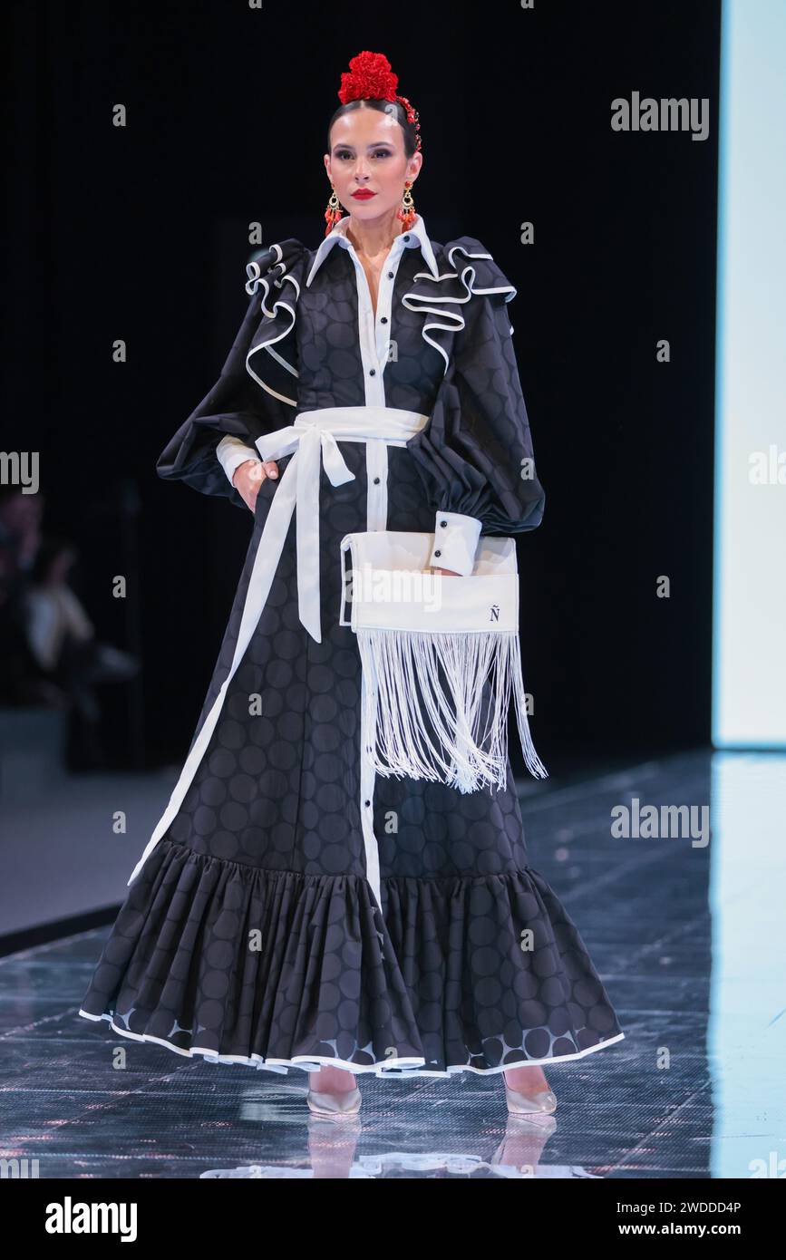 Seville, Spain. 18th Jan, 2024. A model is walking the runway at the ...