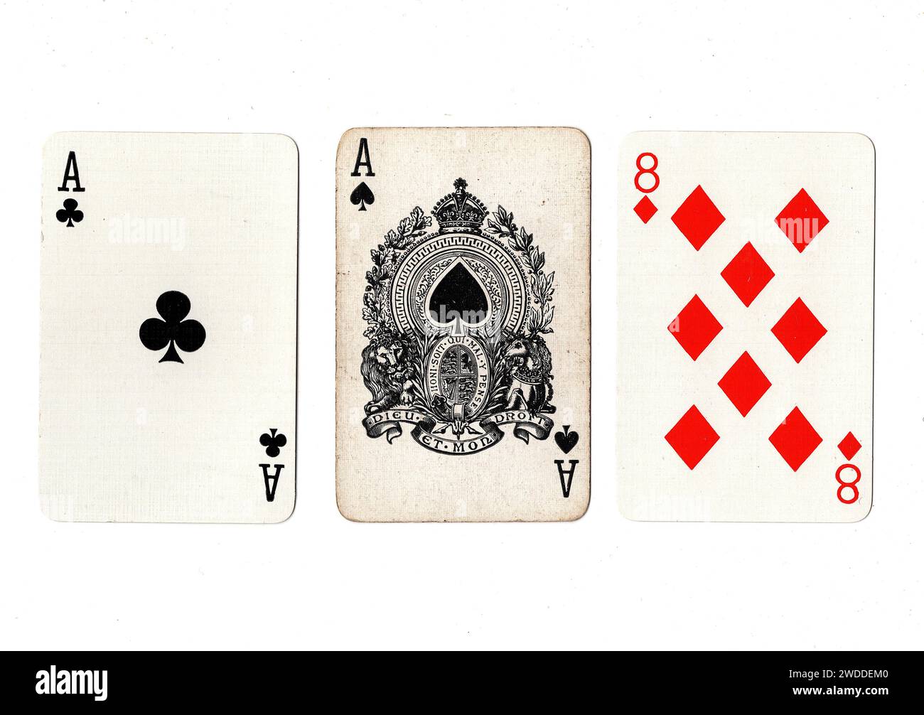 Vintage playing cards showing a pair of black aces and a red eight ...