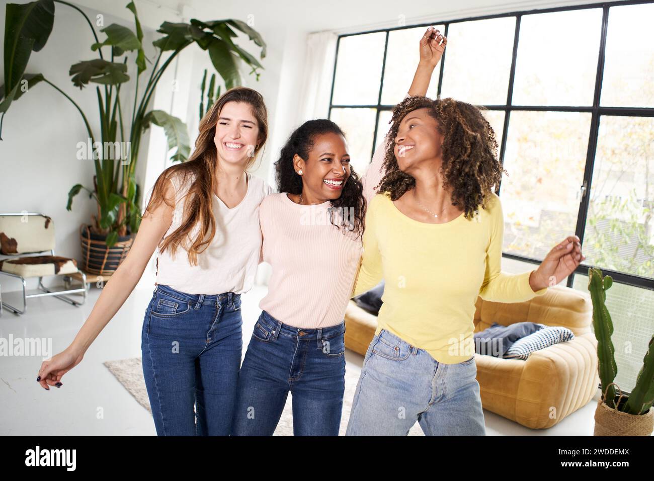 Group of excited attractive multiracial young girls celebrating party ...