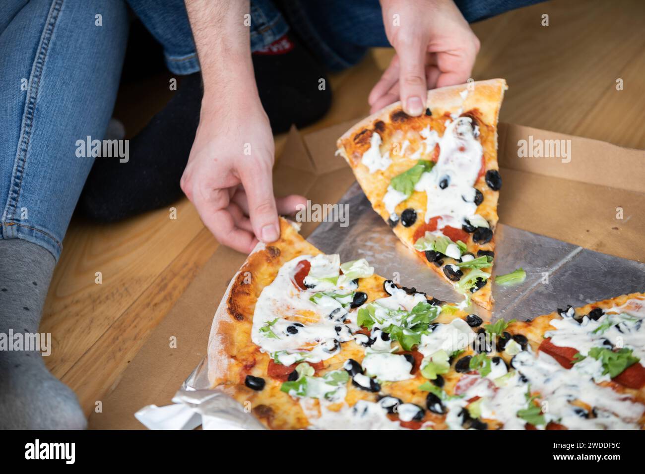A quick lunch eaten on the floor on the run Stock Photo - Alamy