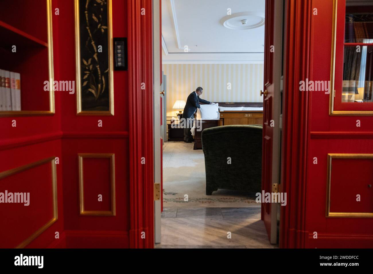 Berlin, Germany. 14th Jan, 2024. Butler Ricardo Dürner adjusts a pillow ...