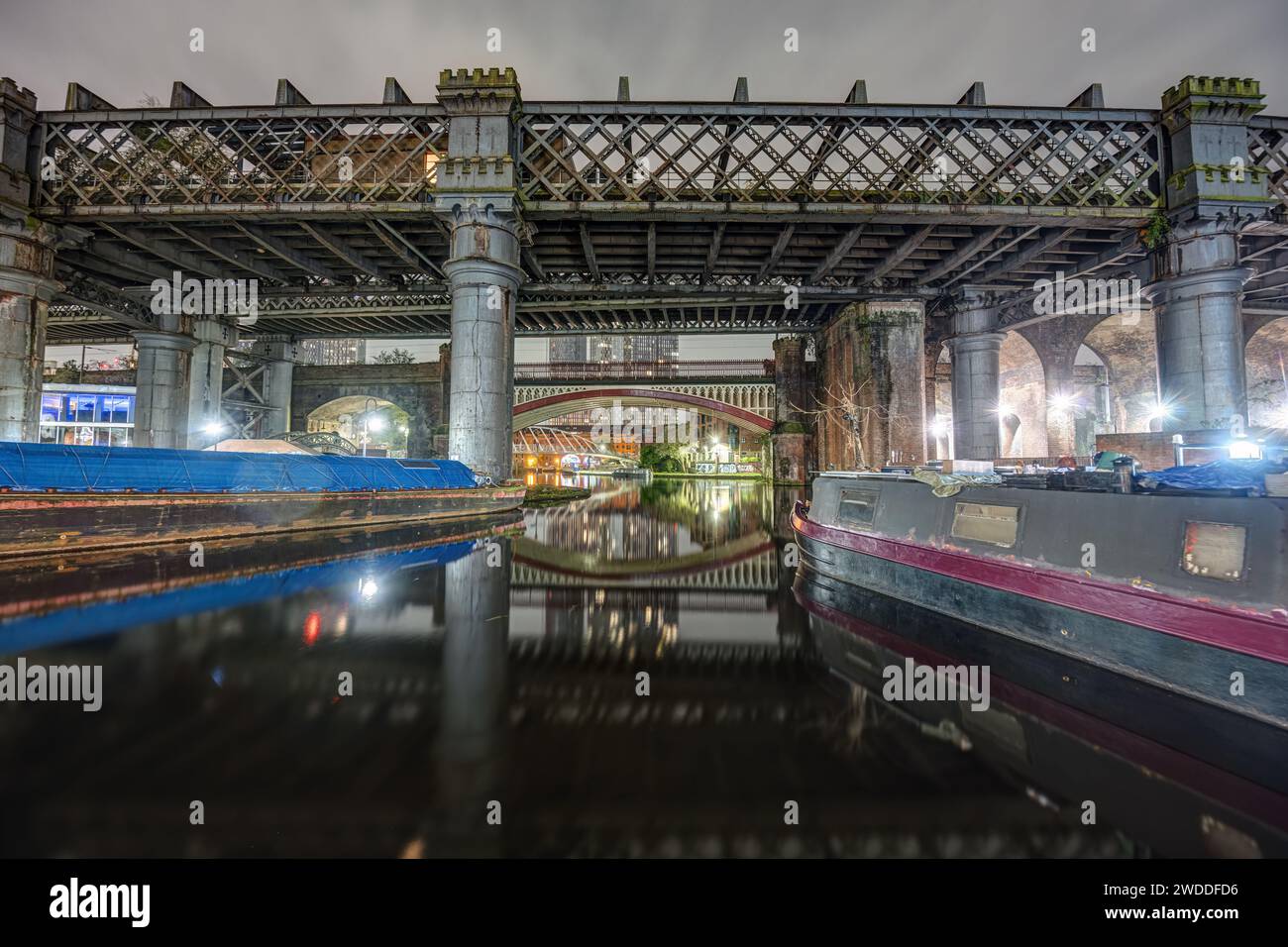 The old Castlefield viaduct and one of the canals in Manchester at ...