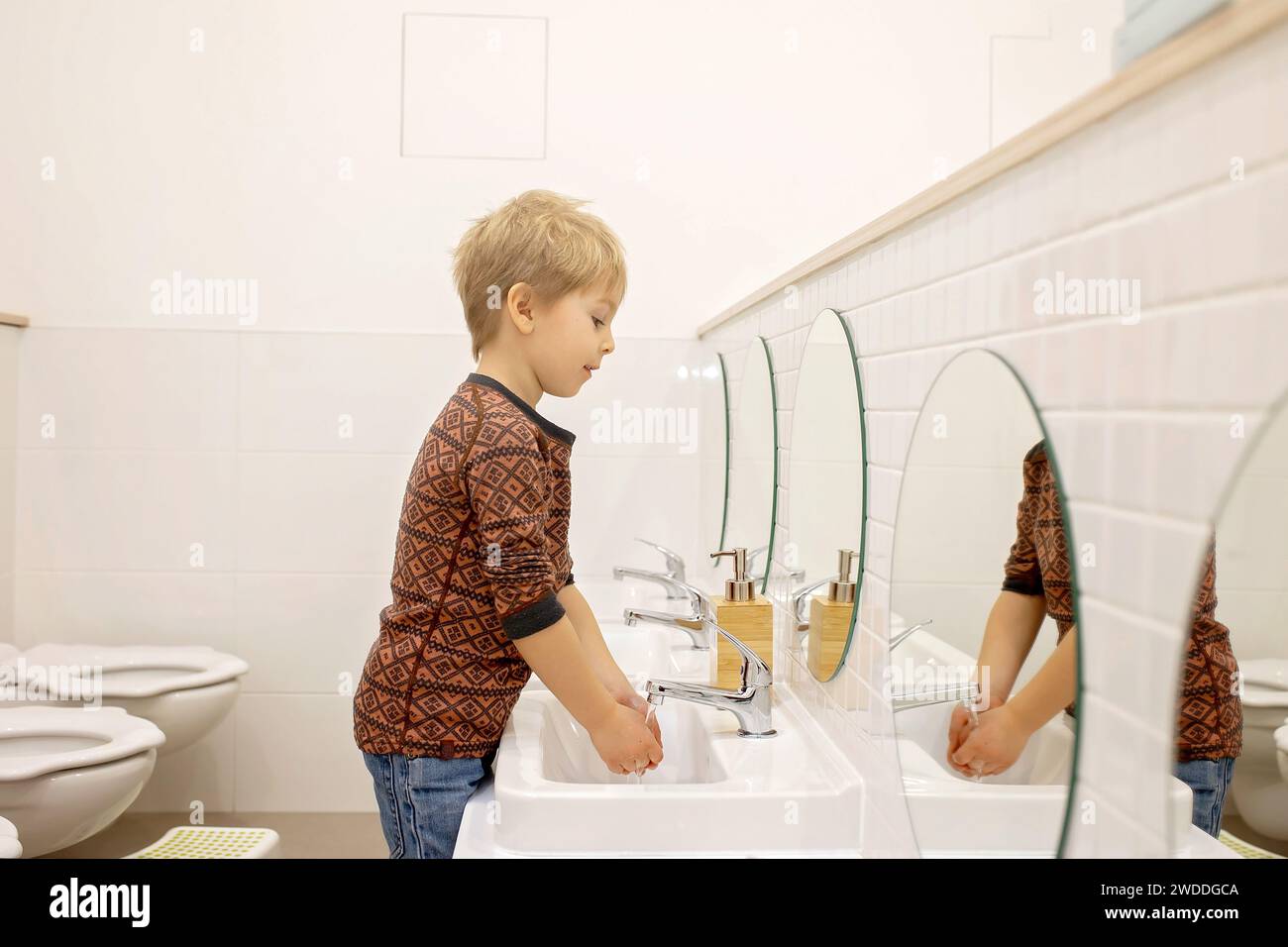 Child, cute boy, washing hands in kindergarden Stock Photo - Alamy