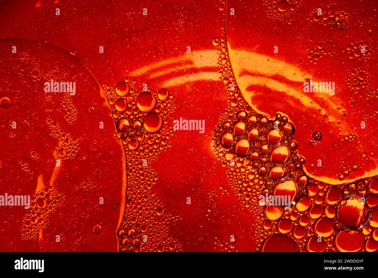 Vibrant red oil background with lava texture in symmetry inspiring ...