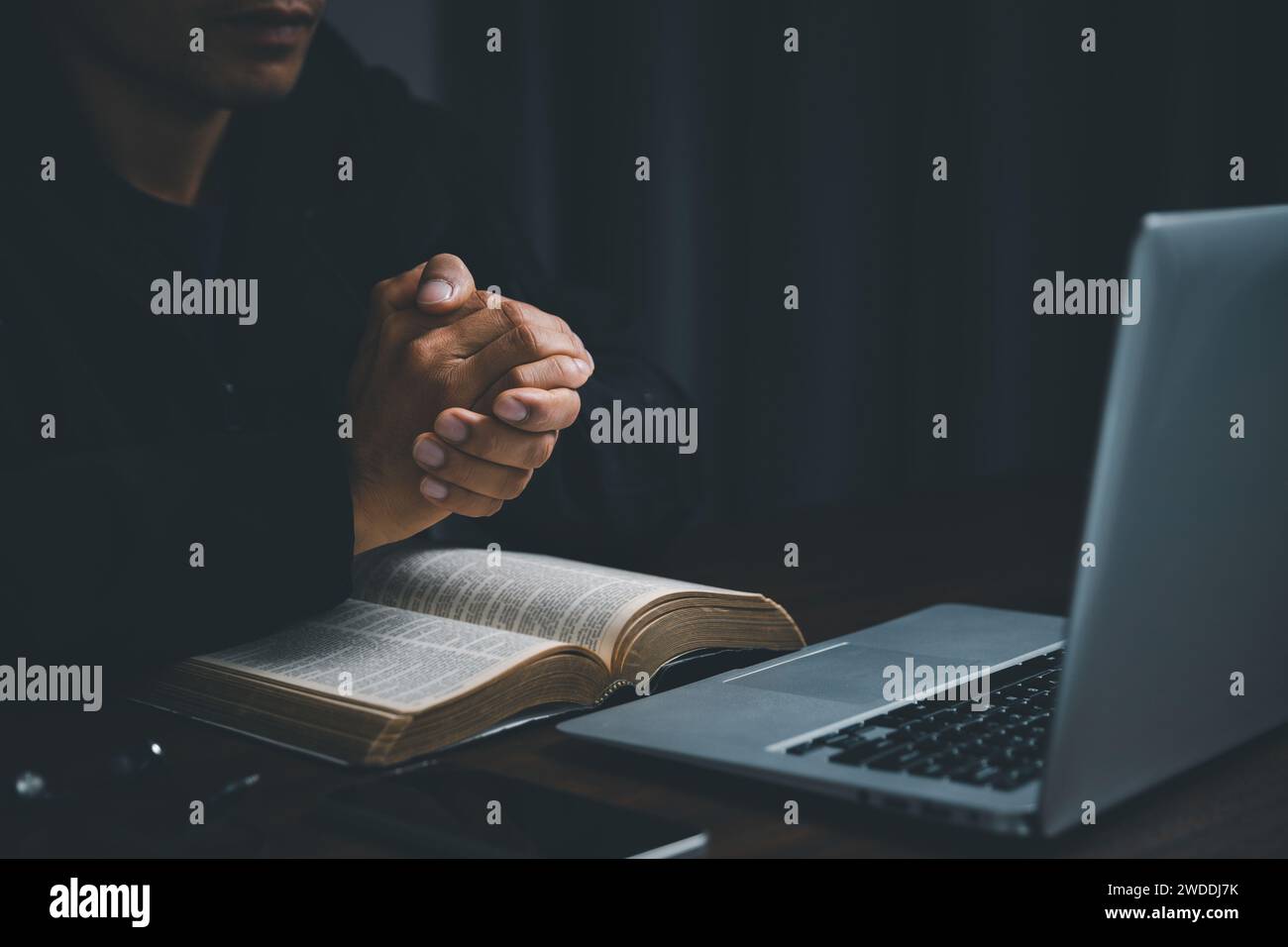 Christian online technology concept. Hands praying of christian with ...