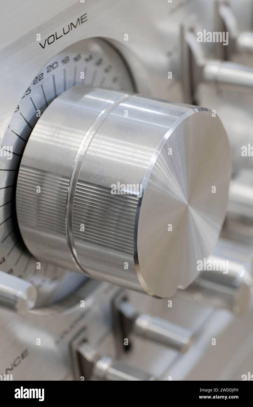 Old vintage stereo amplifier, aluminium front panel with knobs, buttons ...