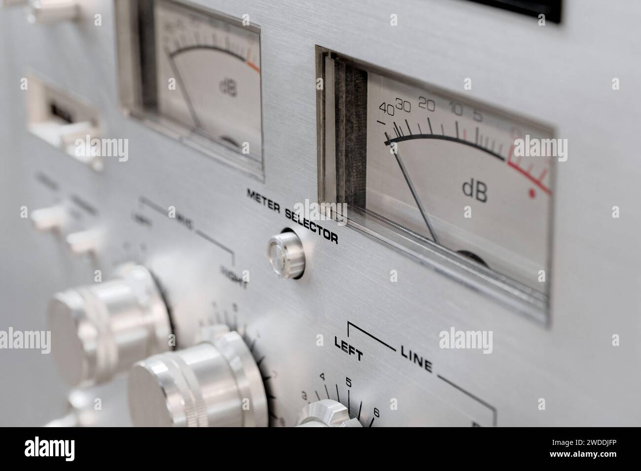 Old vintage stereo amplifier, aluminium front panel with knobs, buttons ...