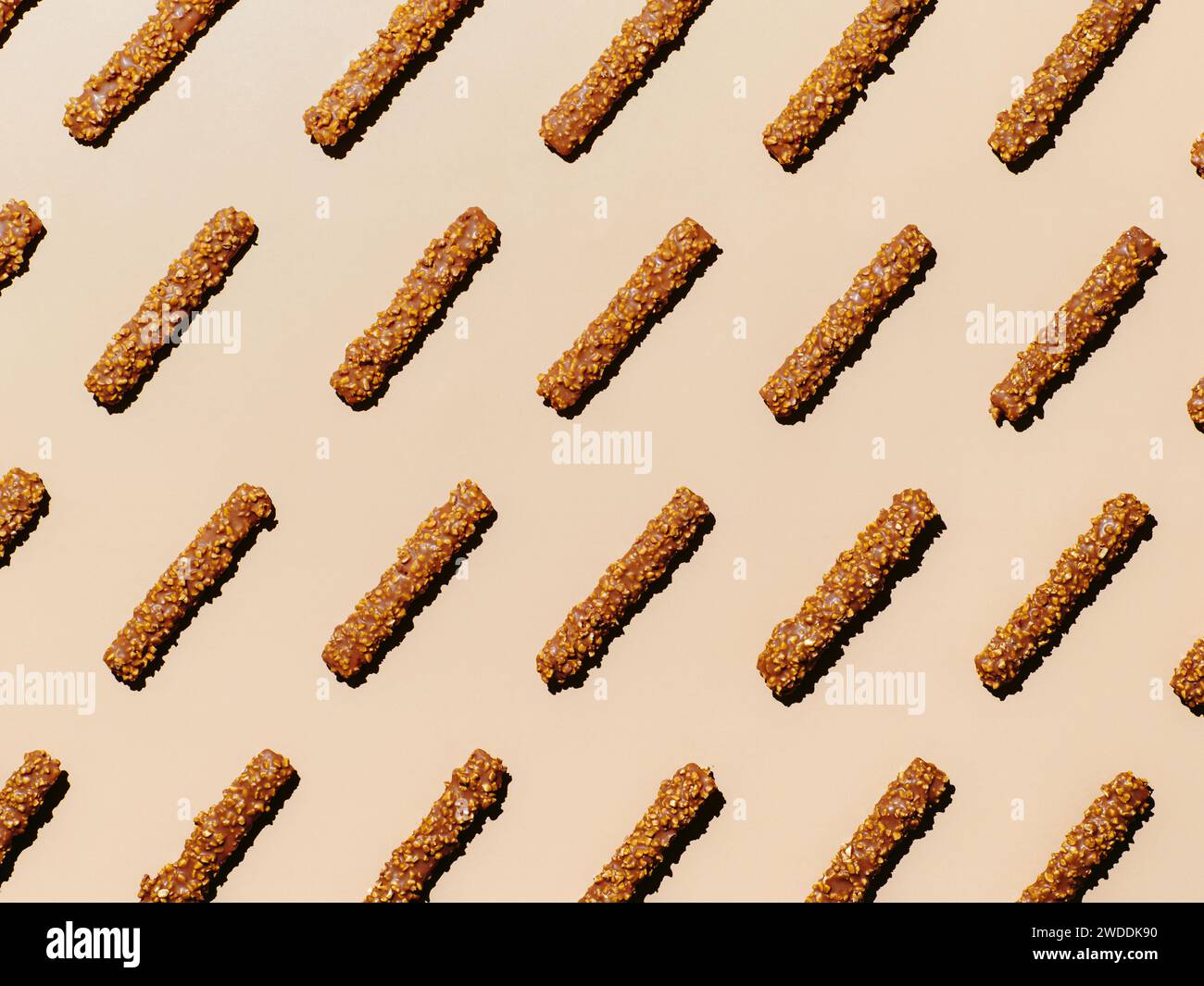 Chocolate candy with peanuts. Long sticks chocolate candy pattern on ...