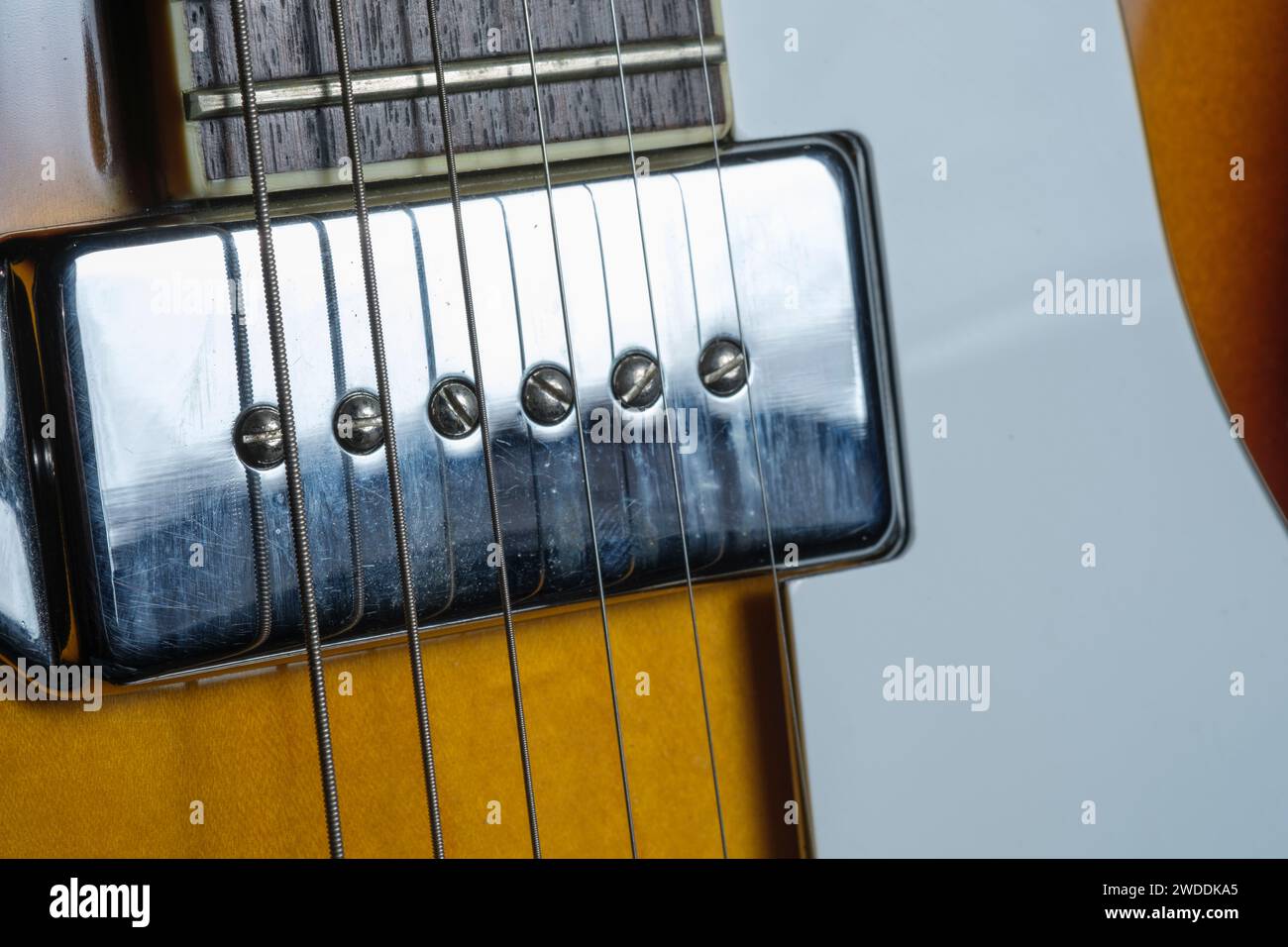 Electric guitar pick up with strings and pick guard Stock Photo - Alamy