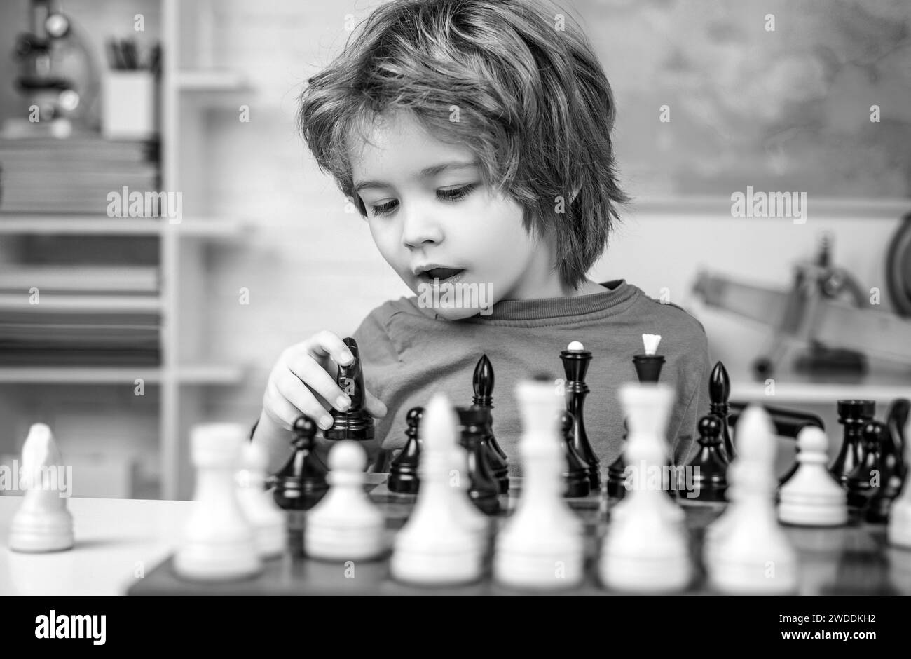 Kid Playing Chess. Thinking kid. Little clever boy thinking about chess ...