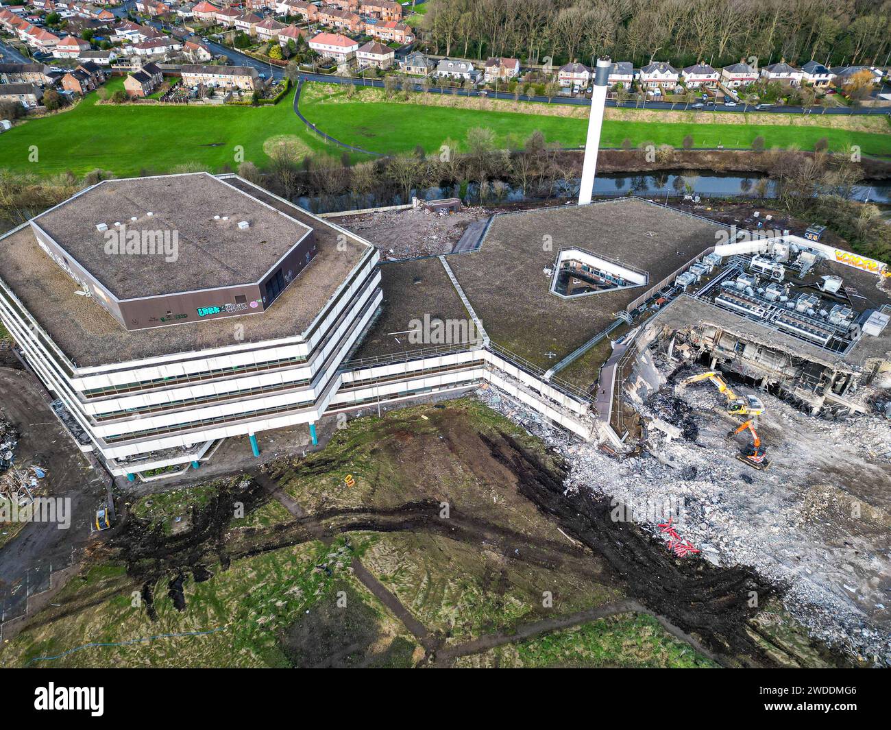 Aerial view of bulldozing demolition of former HMRC office building in ...