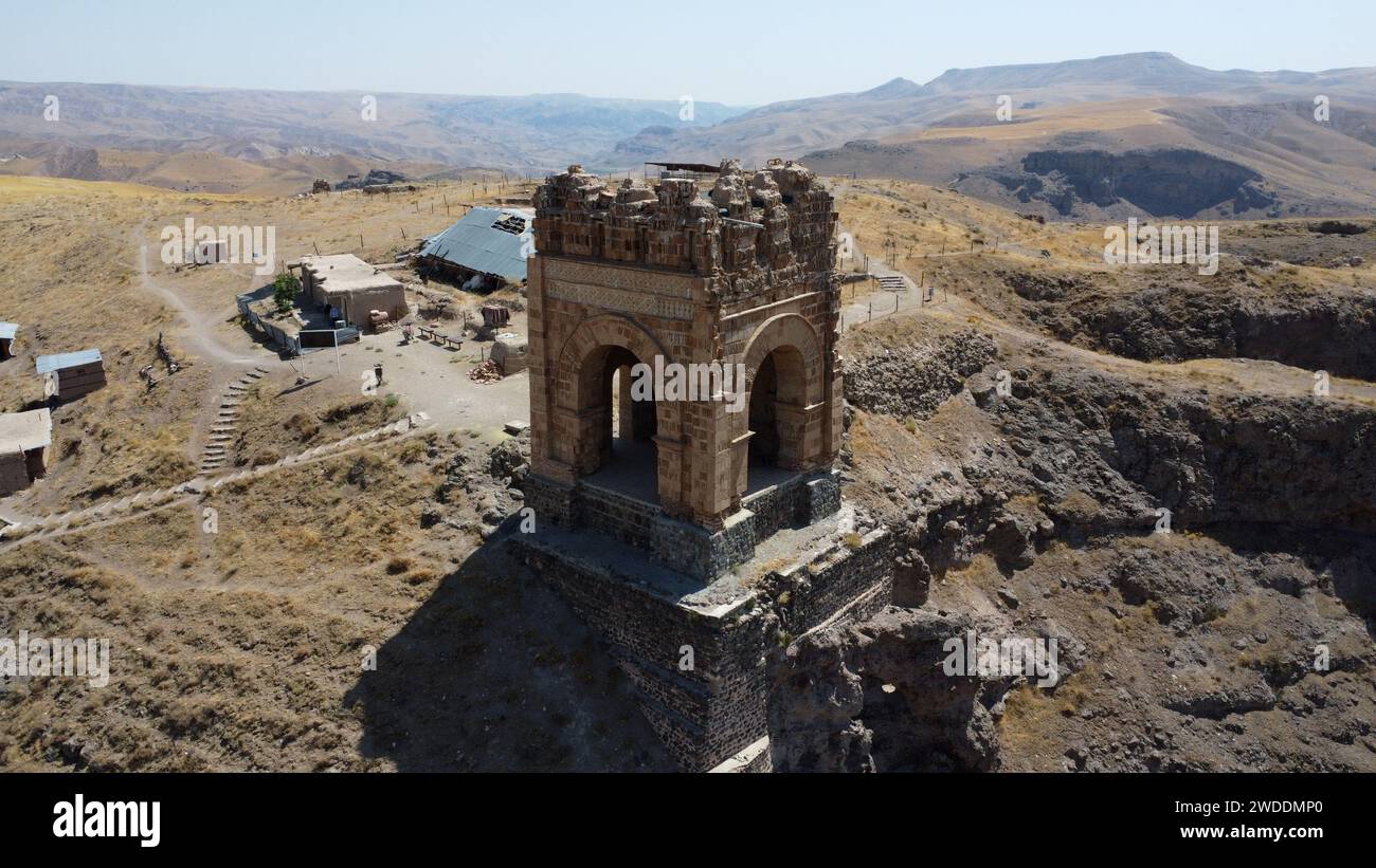 A derelict building stands alone amidst the rugged beauty of a ...