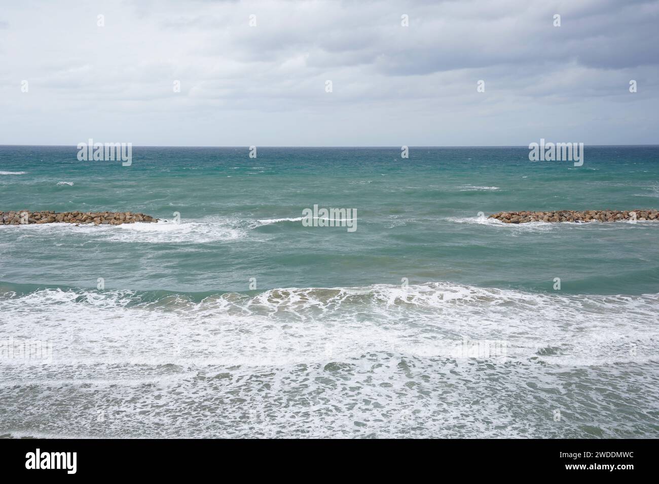 Strong currents and waves in the sea. Waves successfully crash into the ...