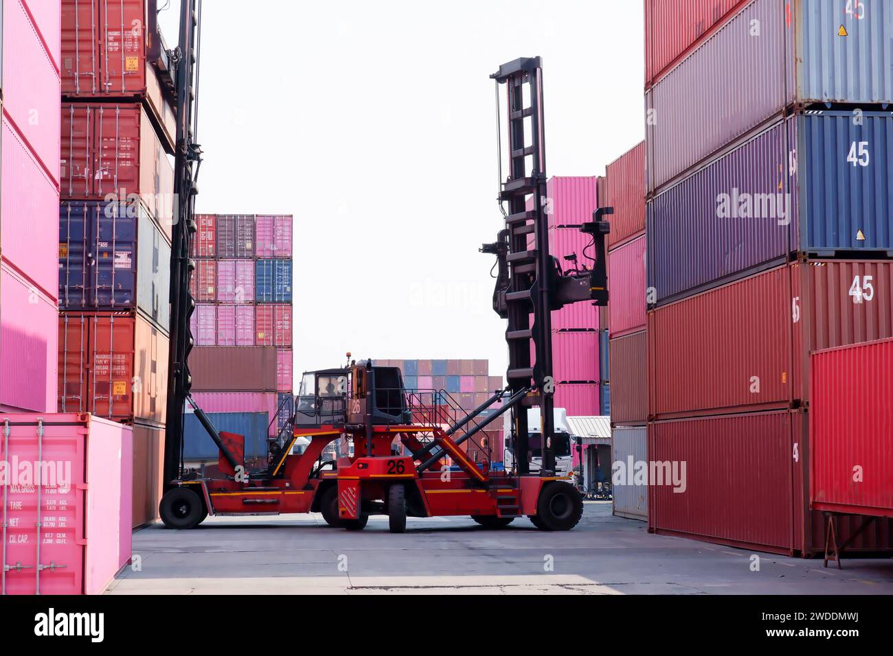 Two container lift trucks with container lifting equipment with a stack ...