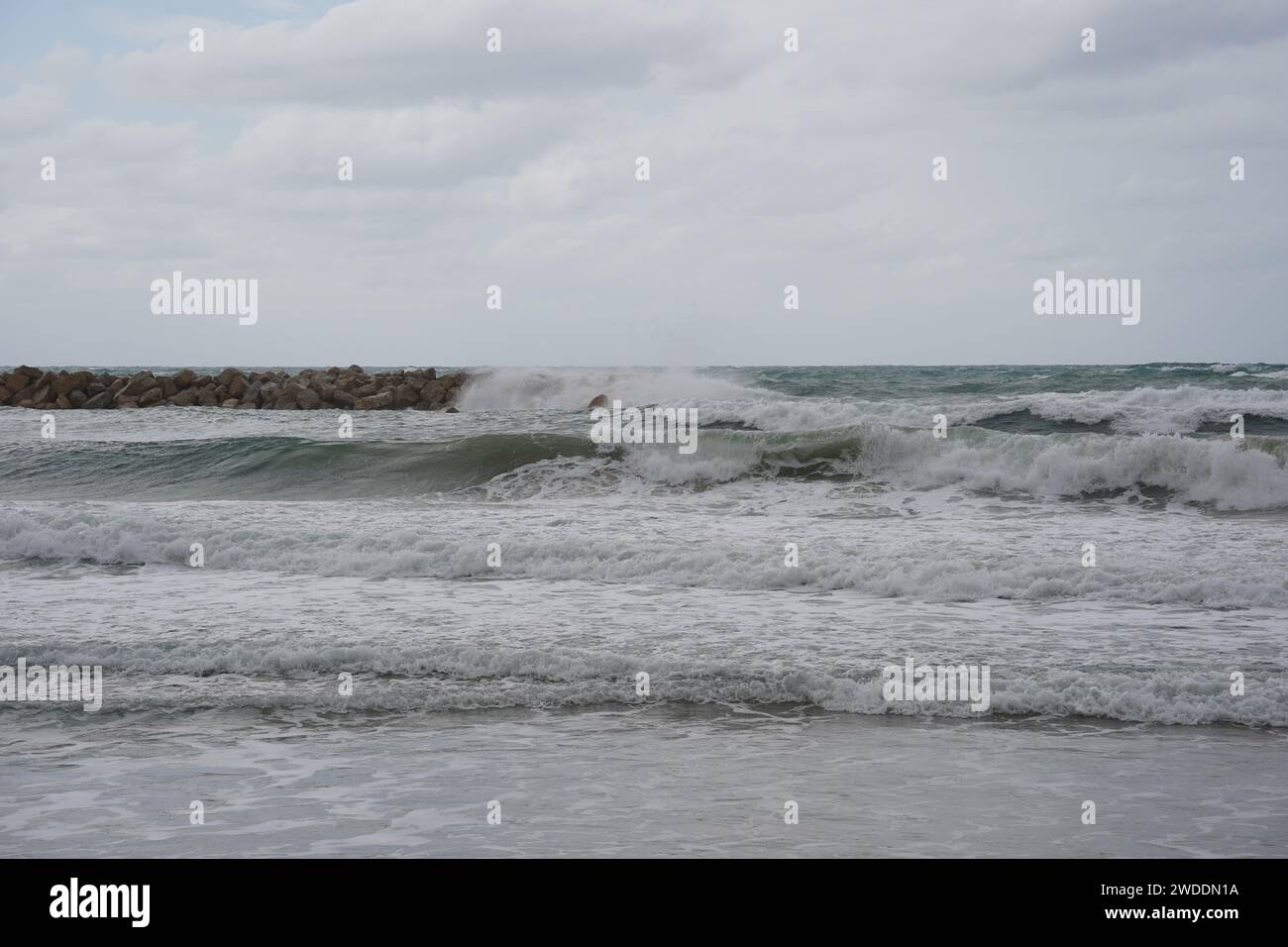 Strong currents and waves in the sea. Waves successfully crash into the ...