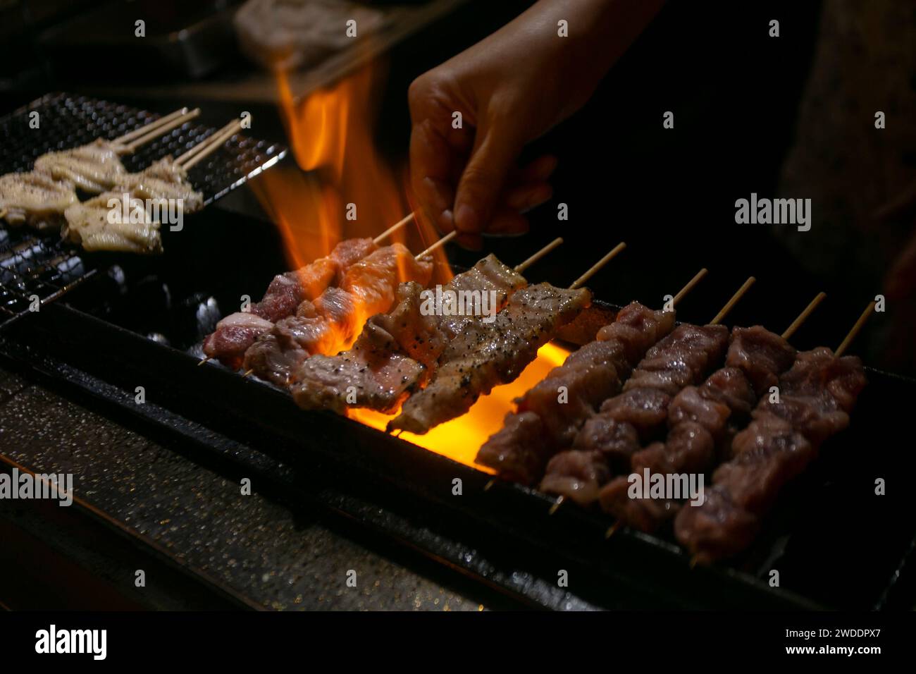 Grilled yakitori chicken skewers at an Izakaya restaurant in Omoide ...