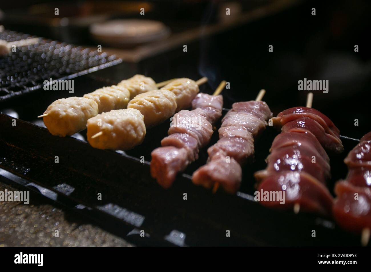 Grilled yakitori chicken skewers at an Izakaya restaurant in Omoide ...