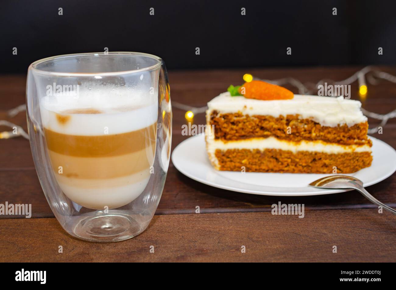 Carrot sponge cake with cream and walnuts and Cappuccino coffee Stock ...