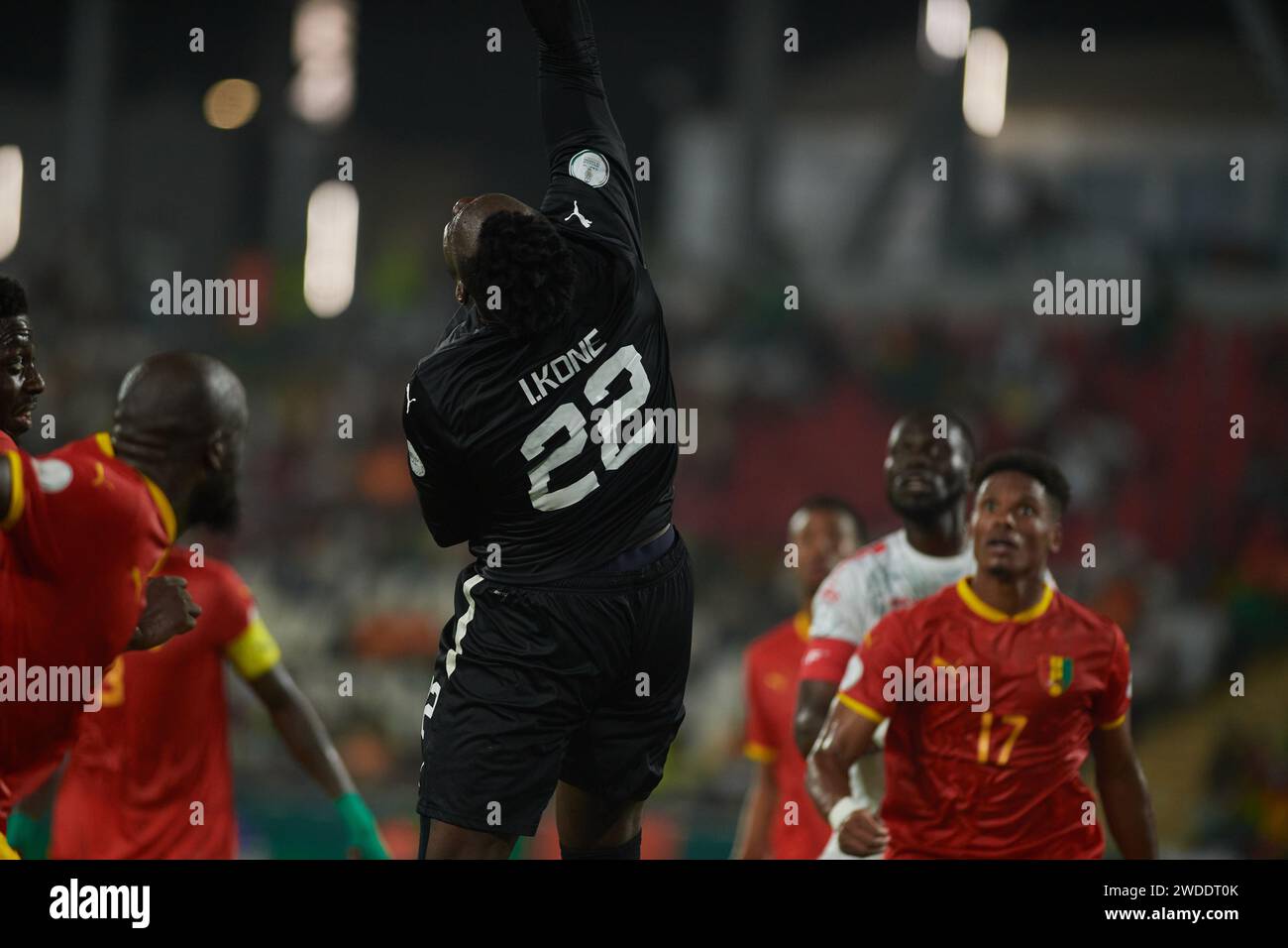 Guinean goalkeeper Ibrahim Koné in an aerial duel to clear the ball ...